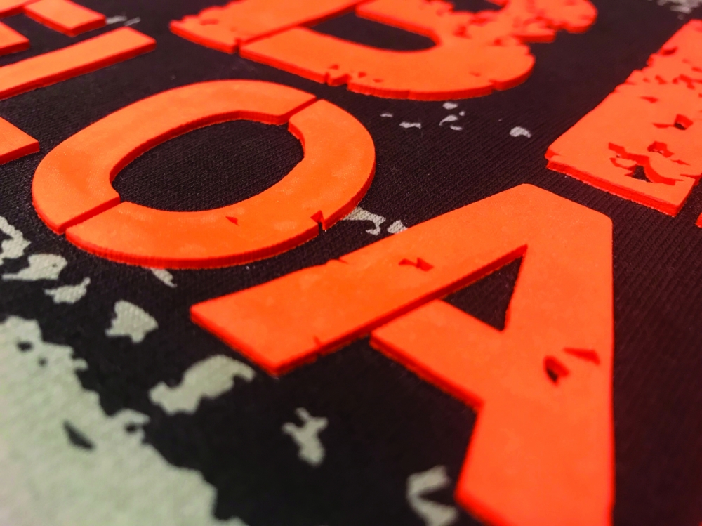 Orange Hi Build screen print, with a black background using plastisol ...